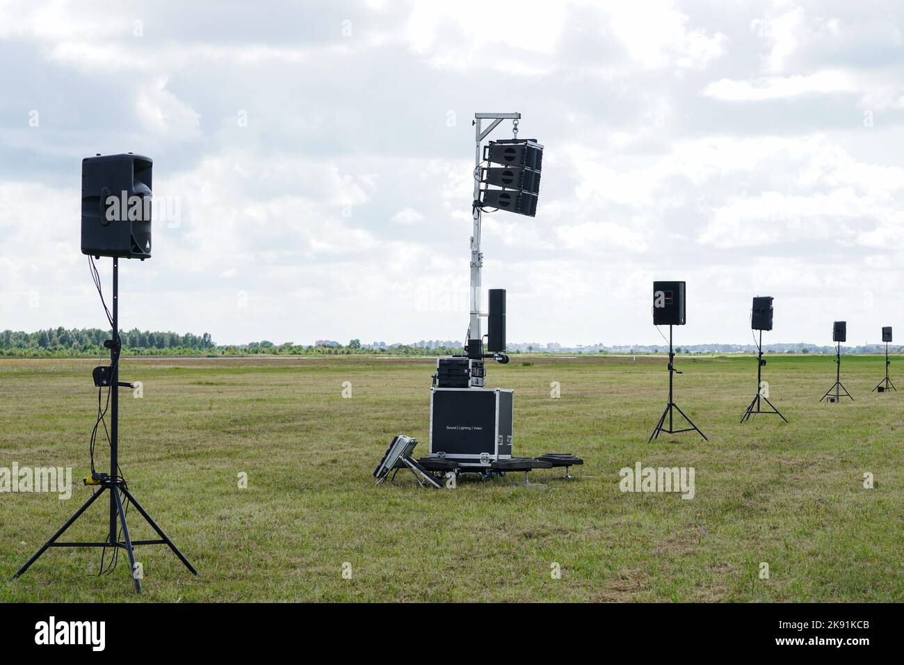 Outdoor audio speaker system elements at an outdoor area event on the ...