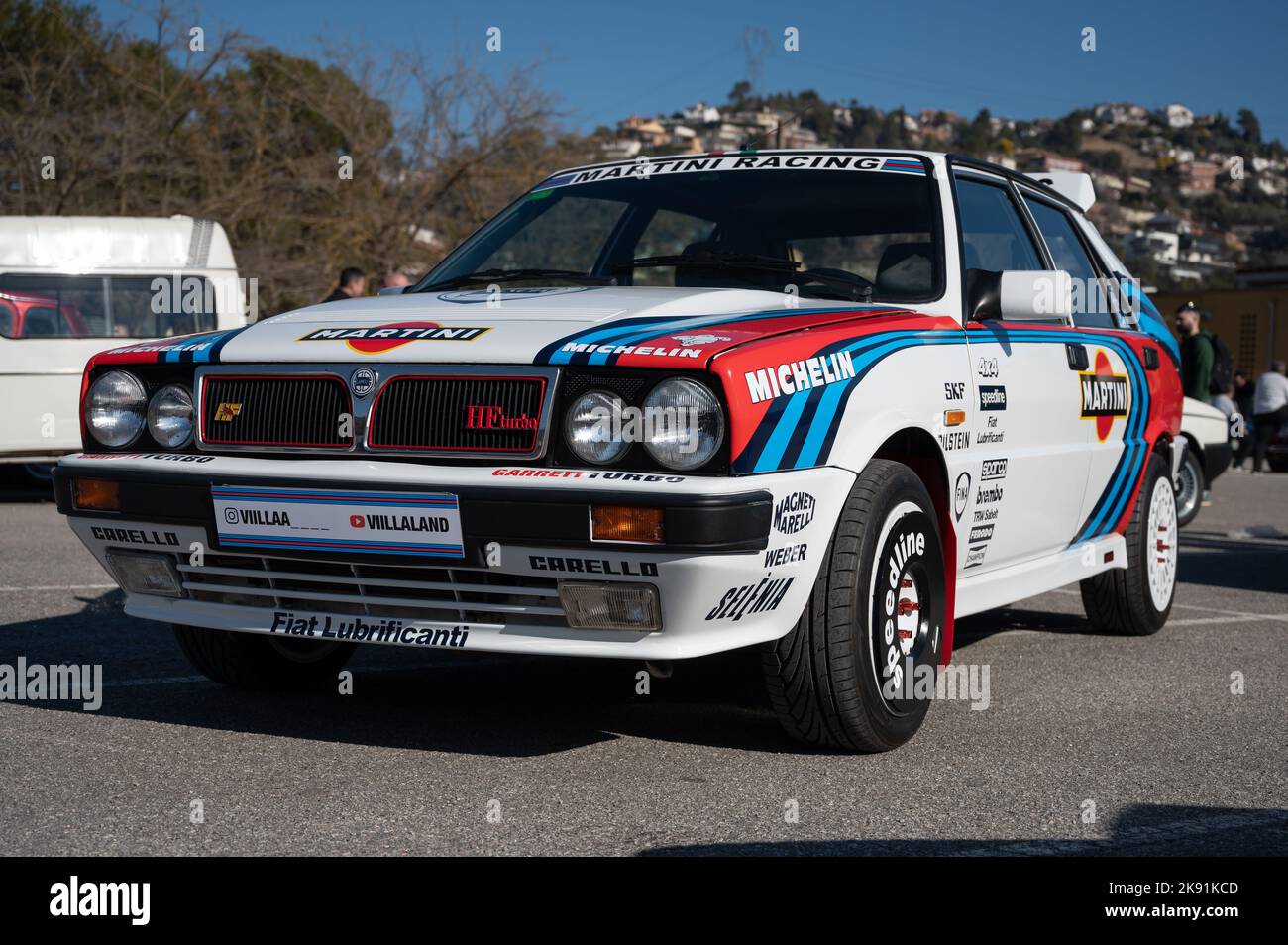 A closeup of the front of a Lancia Delta HF parked on the street Stock ...