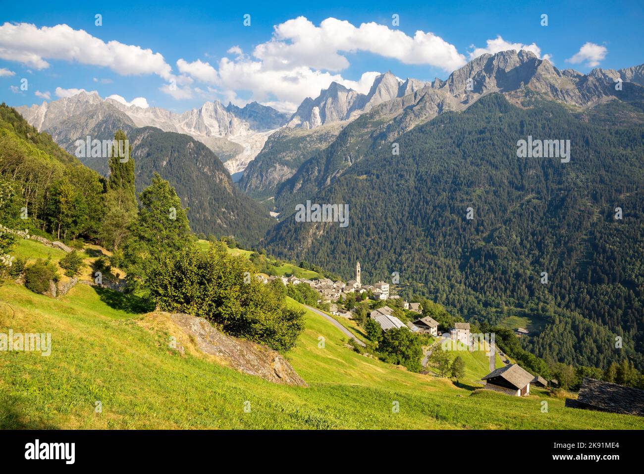 The Soglio village uder the alps meadows and Piz Badile, Pizzo Cengalo ...