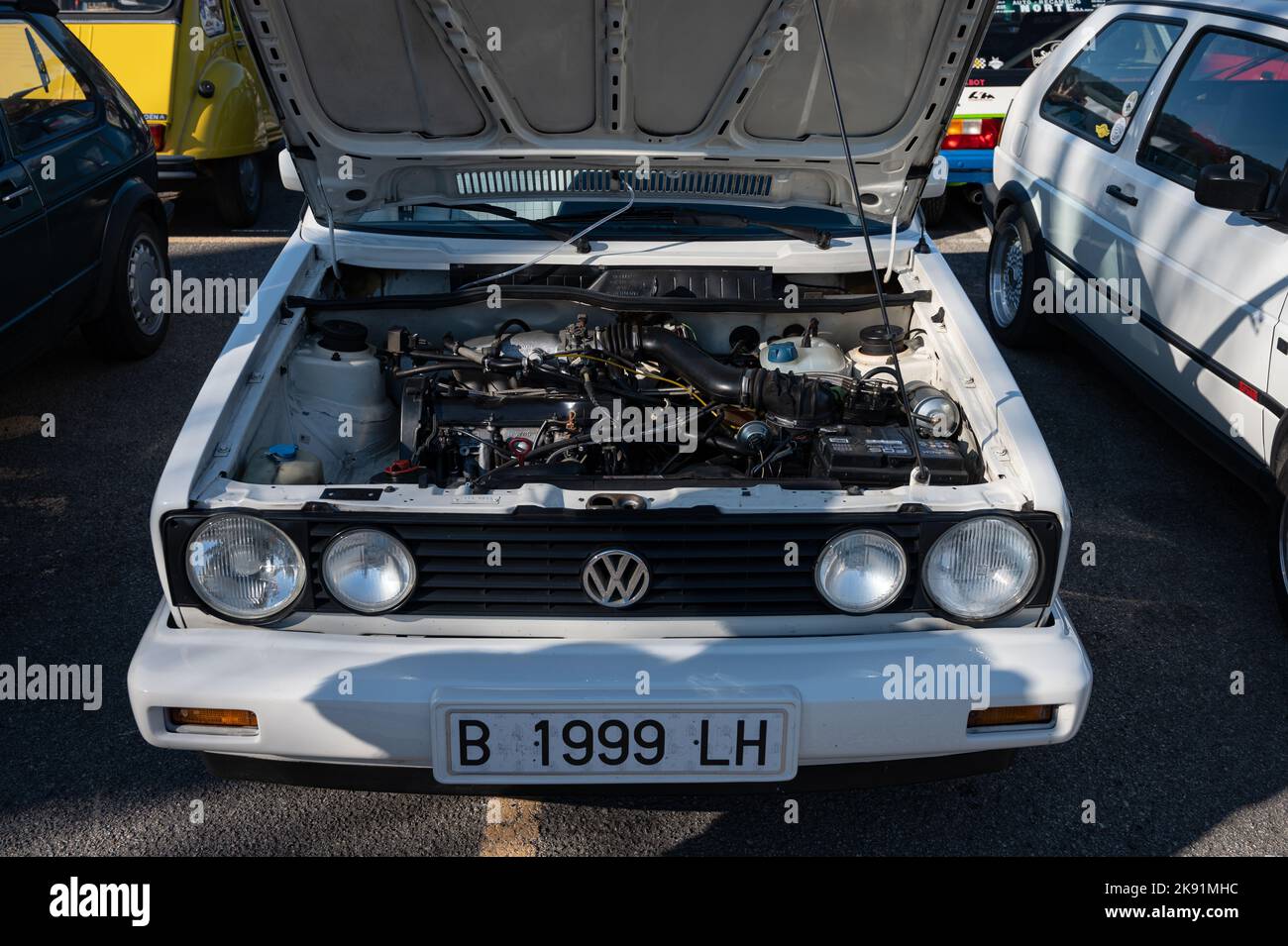 The detail of the engine of an old white Volkswagen Golf second ...