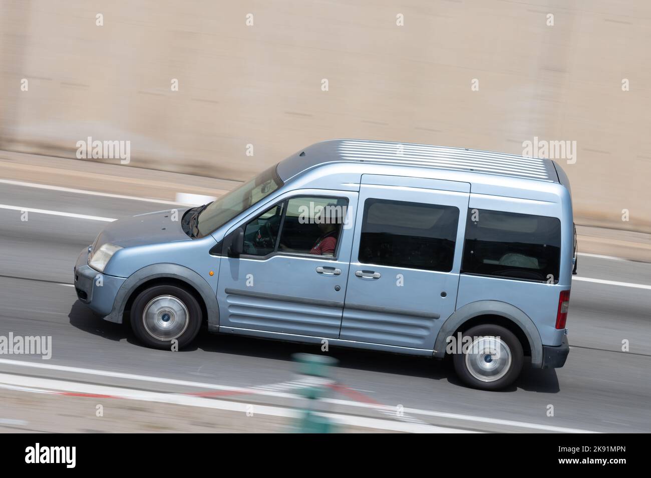 A small blue van, Ford Tourneo Connect along Barcelona's Ronda Litoral ...