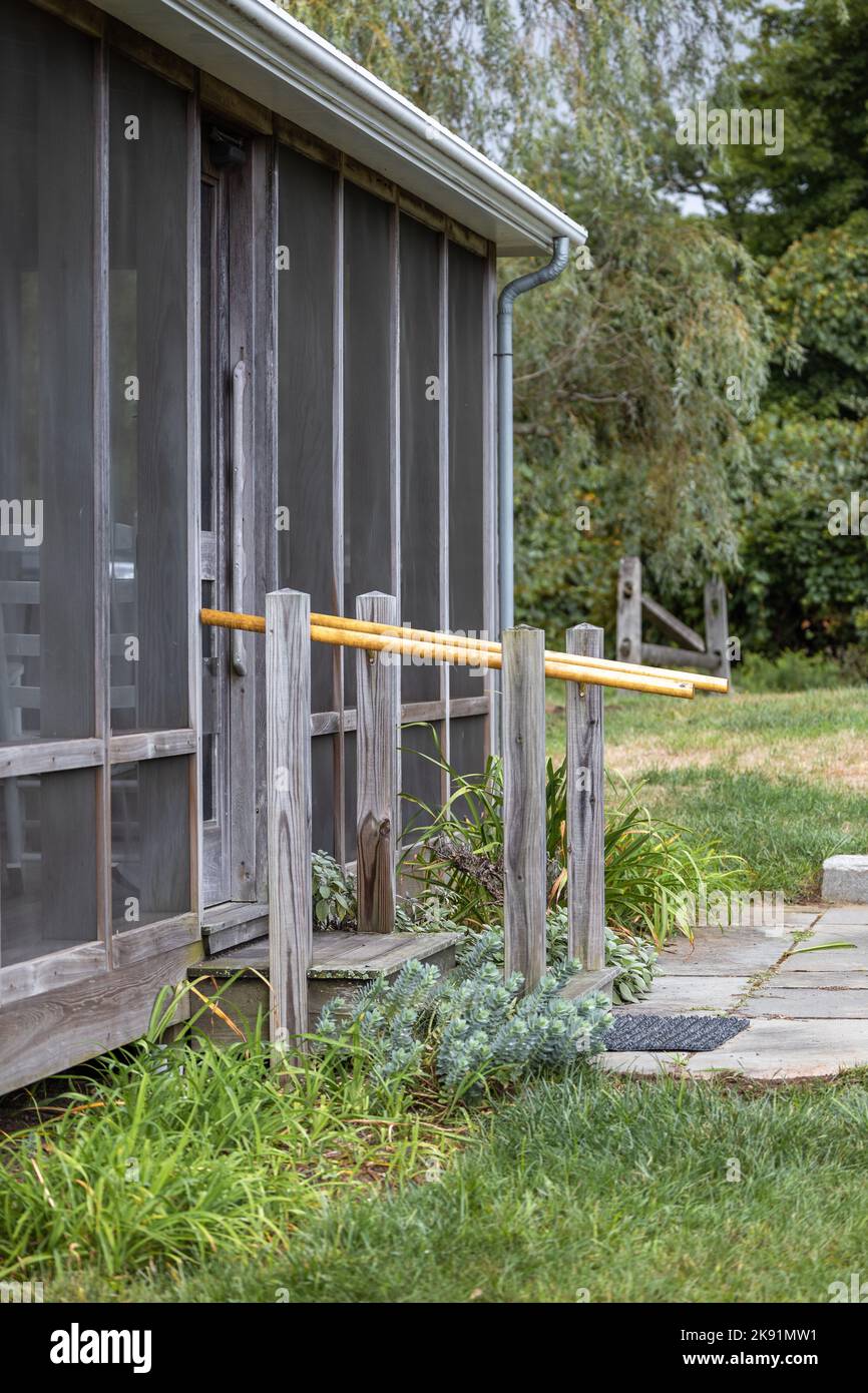 A patio and screened-in porch made with reclaimed wood with handicap ...