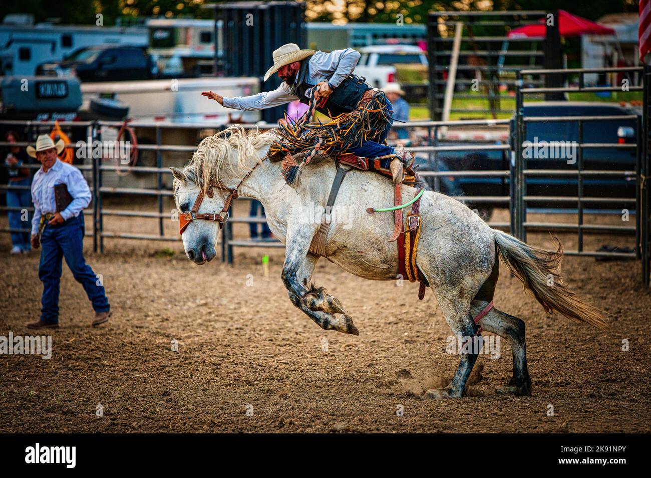 A cowboy bronco riding at the Wyandotte County Kansas Fair Rodeo Stock ...