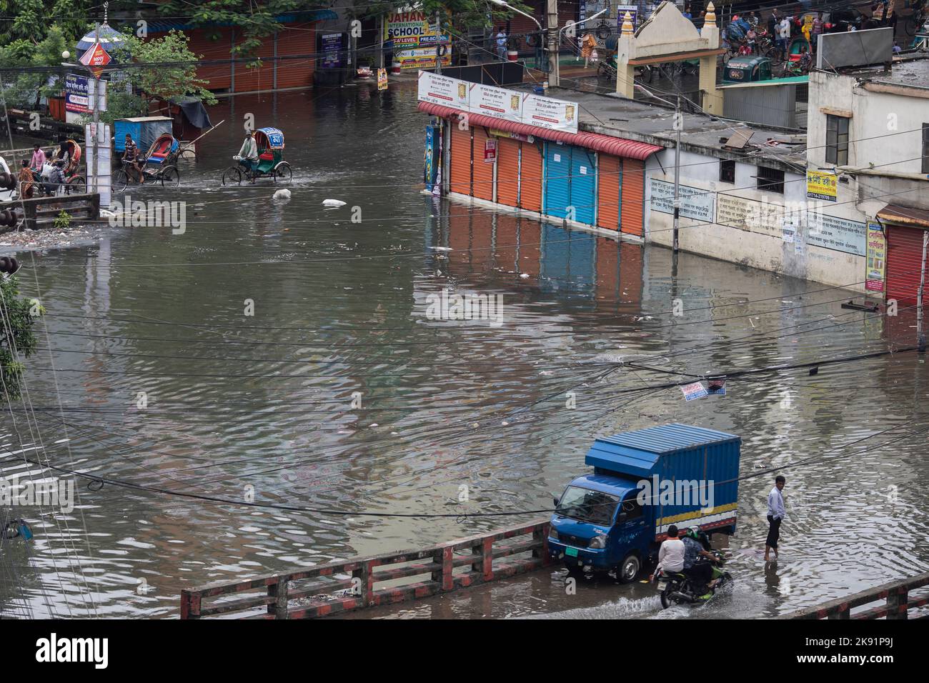 General view of a waterlogged Dhaka street following heavy rains ...