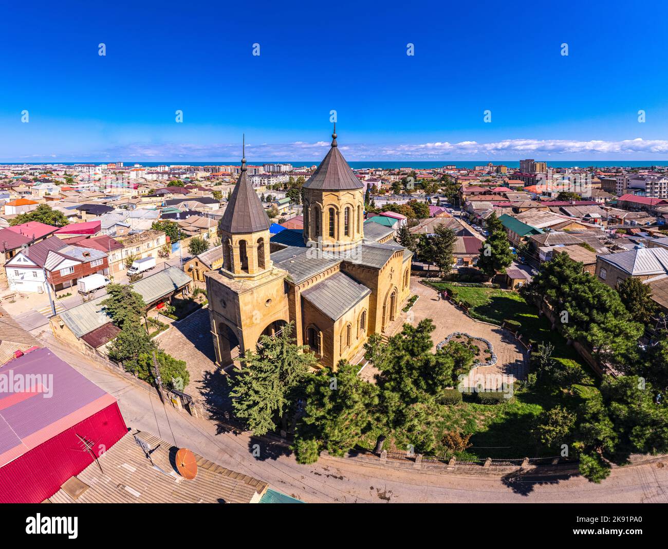 Aerial drone view to old town Derbent, caspian sea and Armenian Church ...
