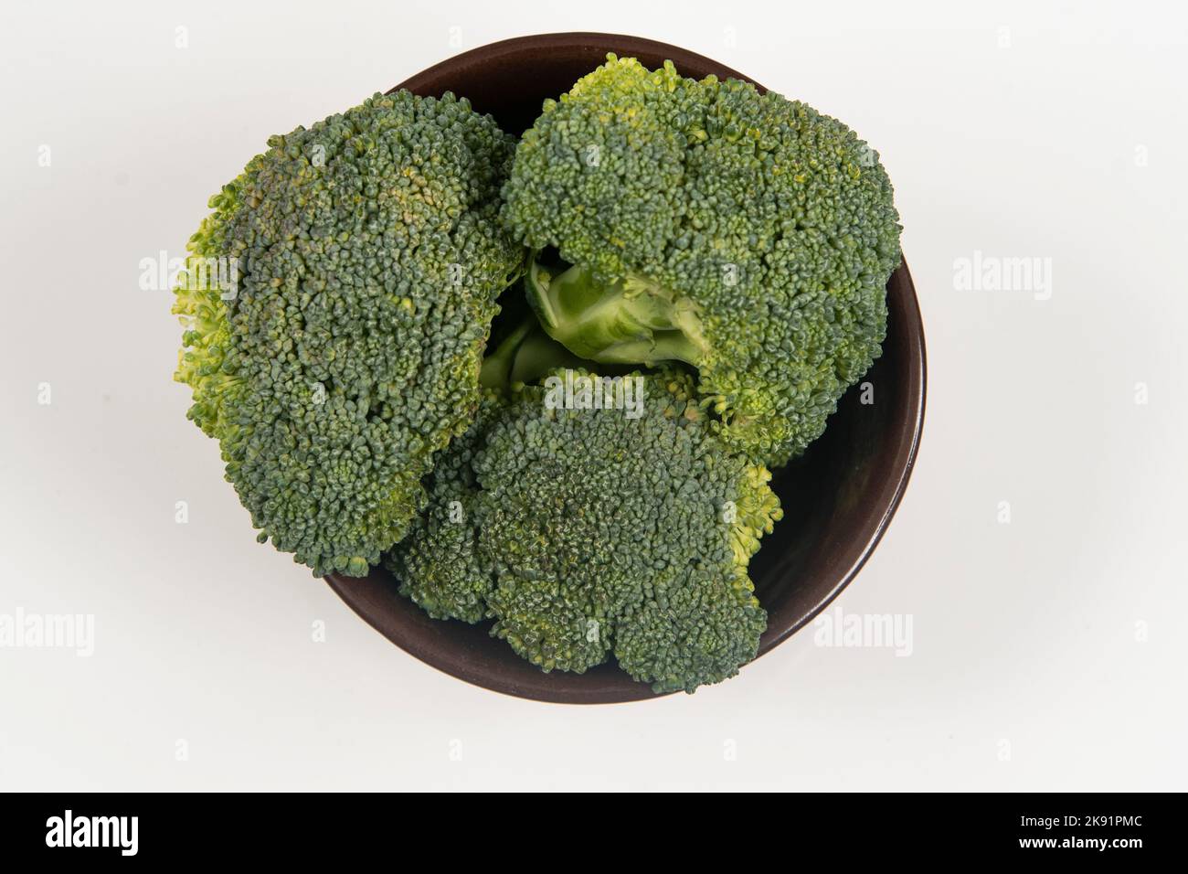 Fresh raw broccoli in pot isolated Stock Photo - Alamy