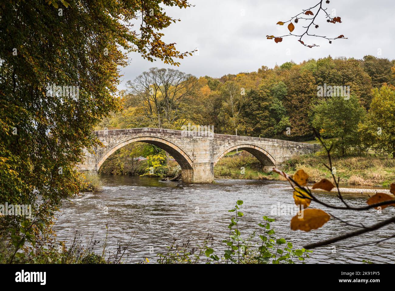 The limestone built bridge at Barden seen spanning the River Wharfe in ...