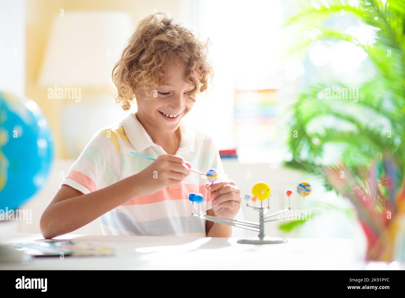 Child with solar system model. Kids planetarium. Little boy coloring ... Child with solar system model. Kids planetarium. Little boy coloring ...