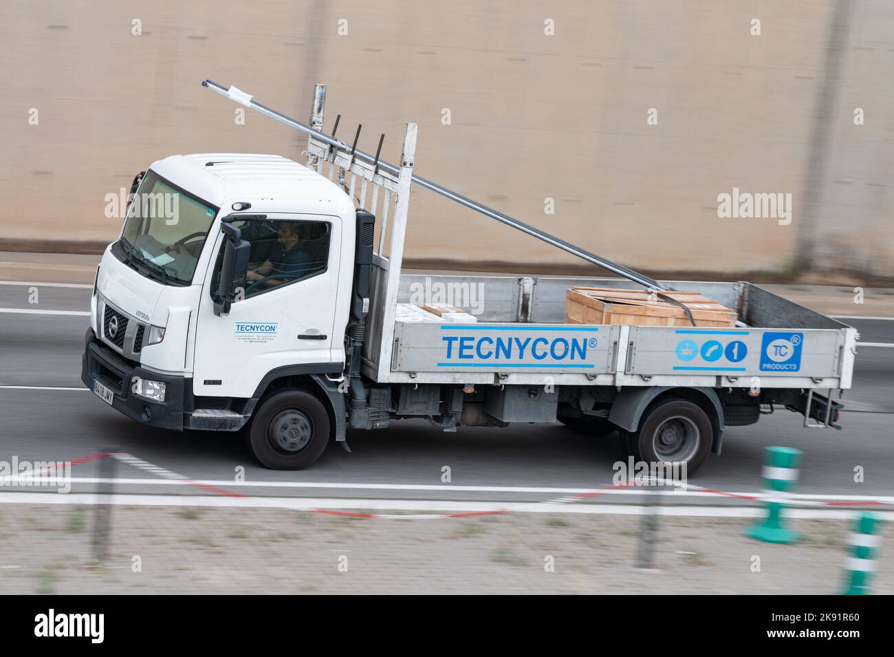A white Nissan NT500 truck circulating along the Ronda Litoral in ...