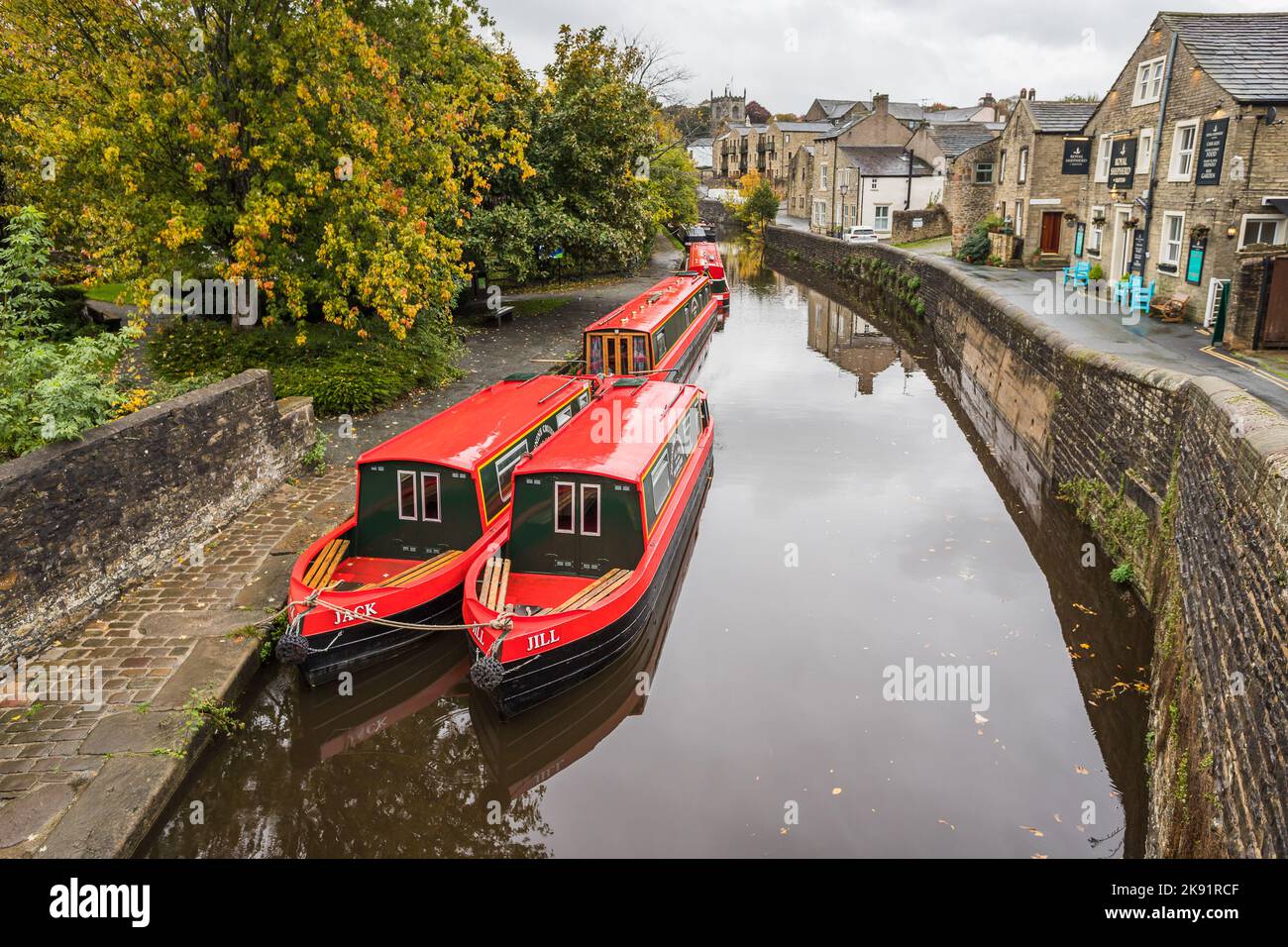 Pretty coloured narrow boats moored in the Springs Branch of the Leeds ...