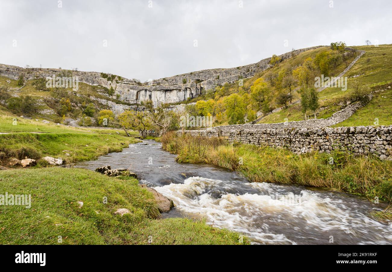 Malham Beck flowing over rocks as it leaves Malham Cove and heads down ...