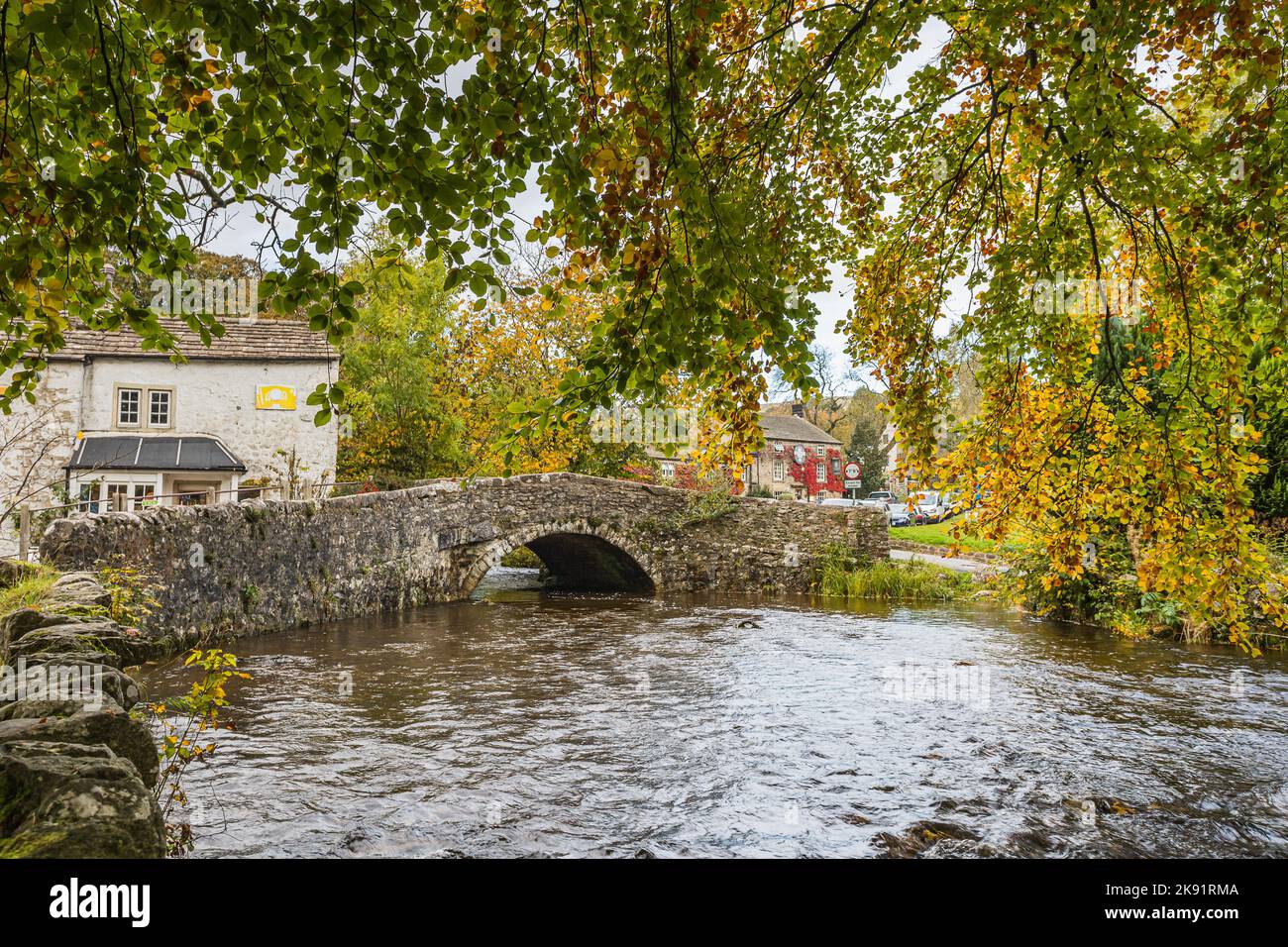 Malham Bridge seen spanning the Malham Beck in the heart of the ...