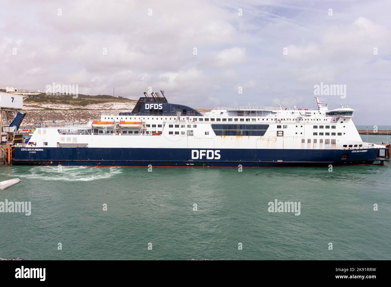 A DFDS Cross-Channel ferry docked at the Port of Dover harbour in Kent ...