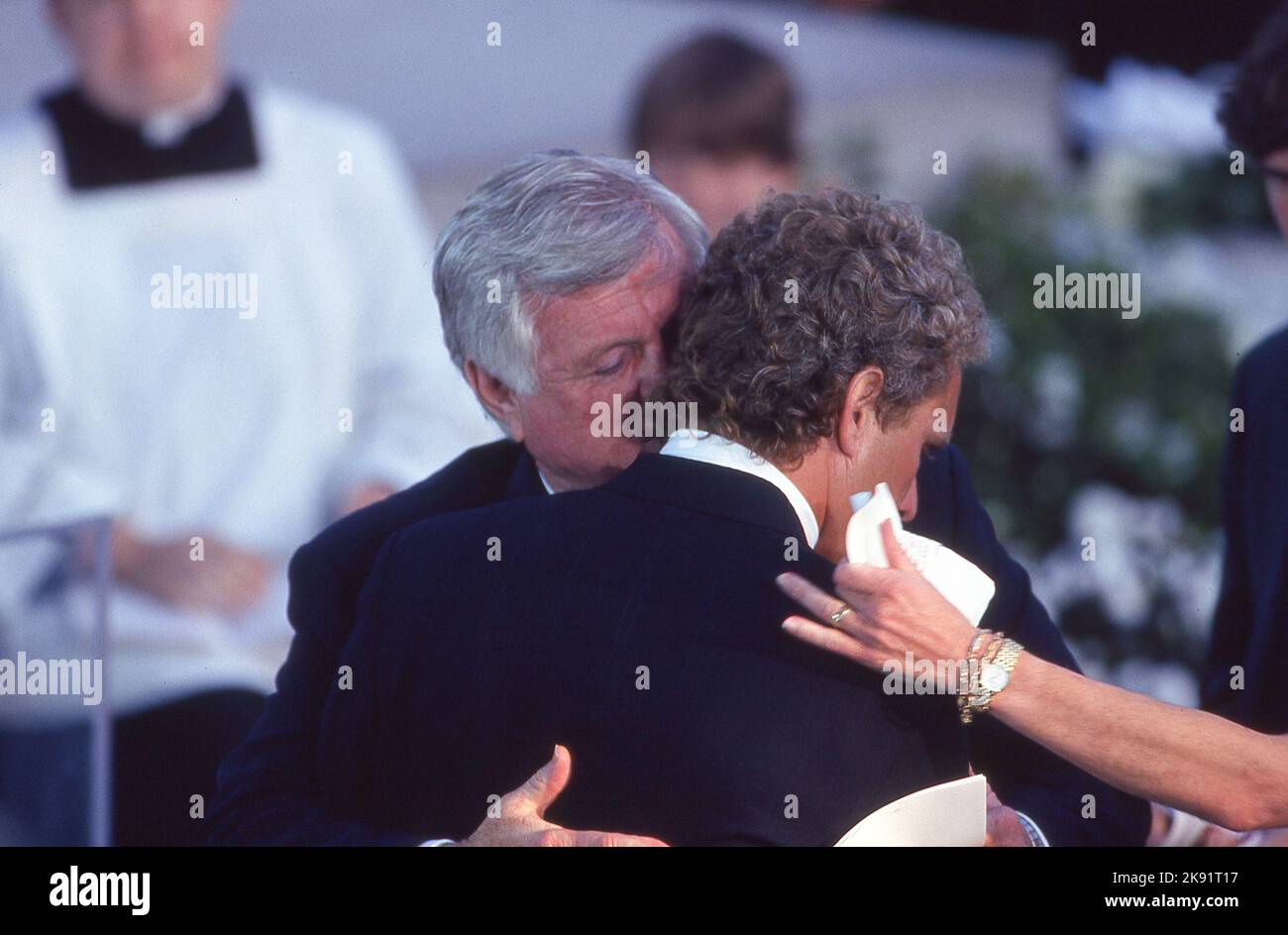 Ted Kennedy and Joe Kennedy embrace The Kennedy family at the JFK grave ...