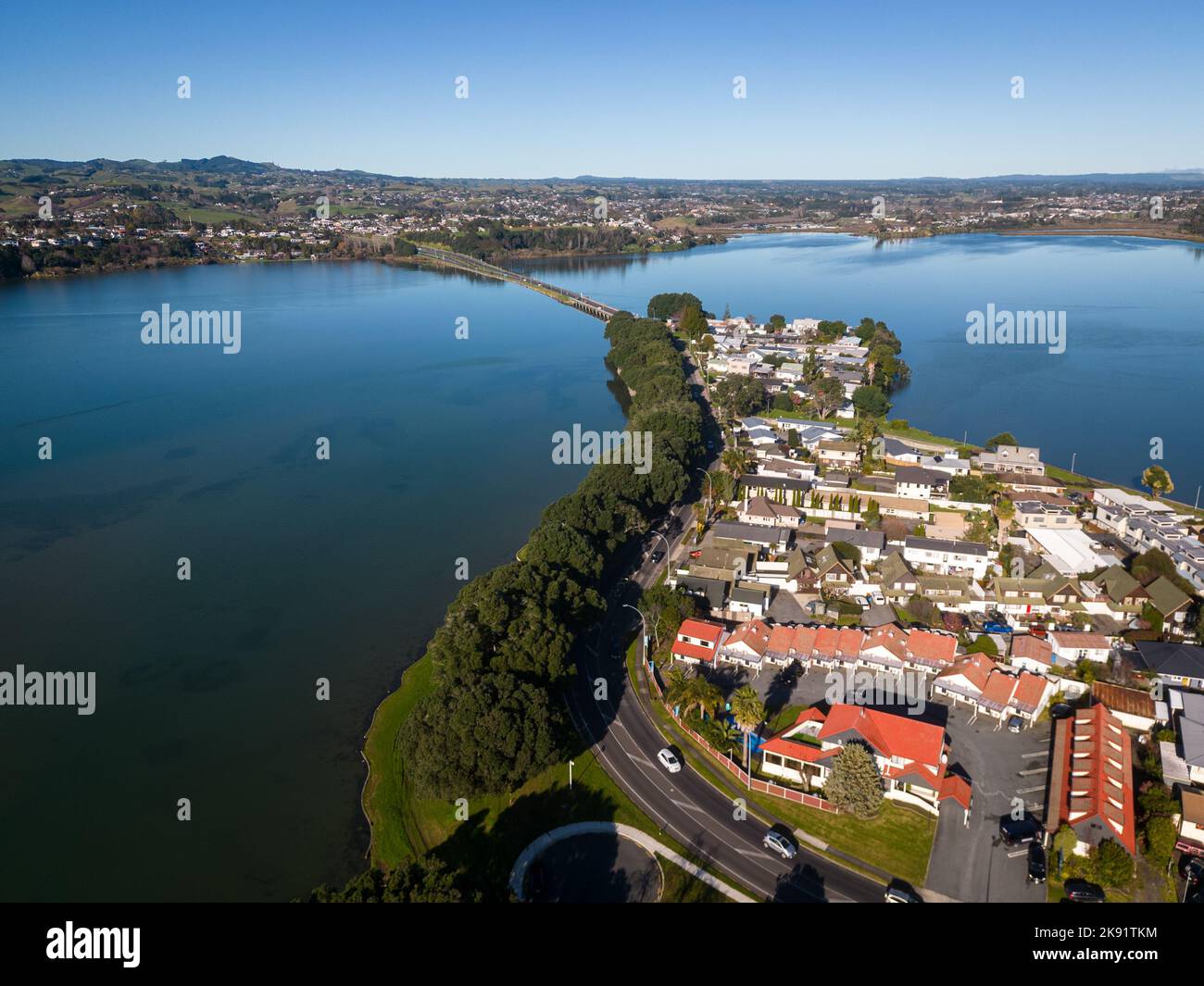 An aerial of land with buildings and trees on the lake Stock Photo - Alamy