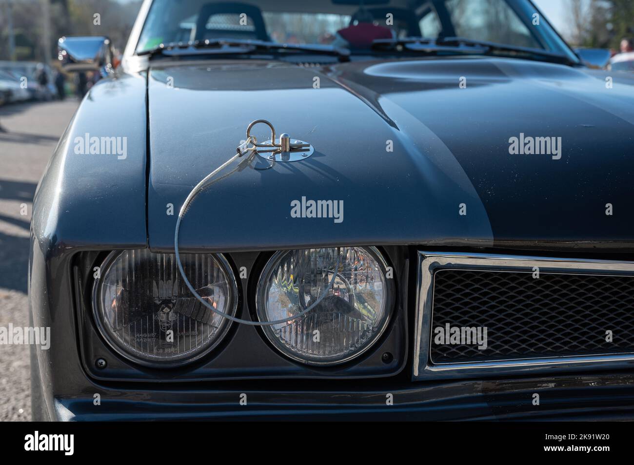 A close up of a hood lock on a gray Ford Capri racing car with two ...