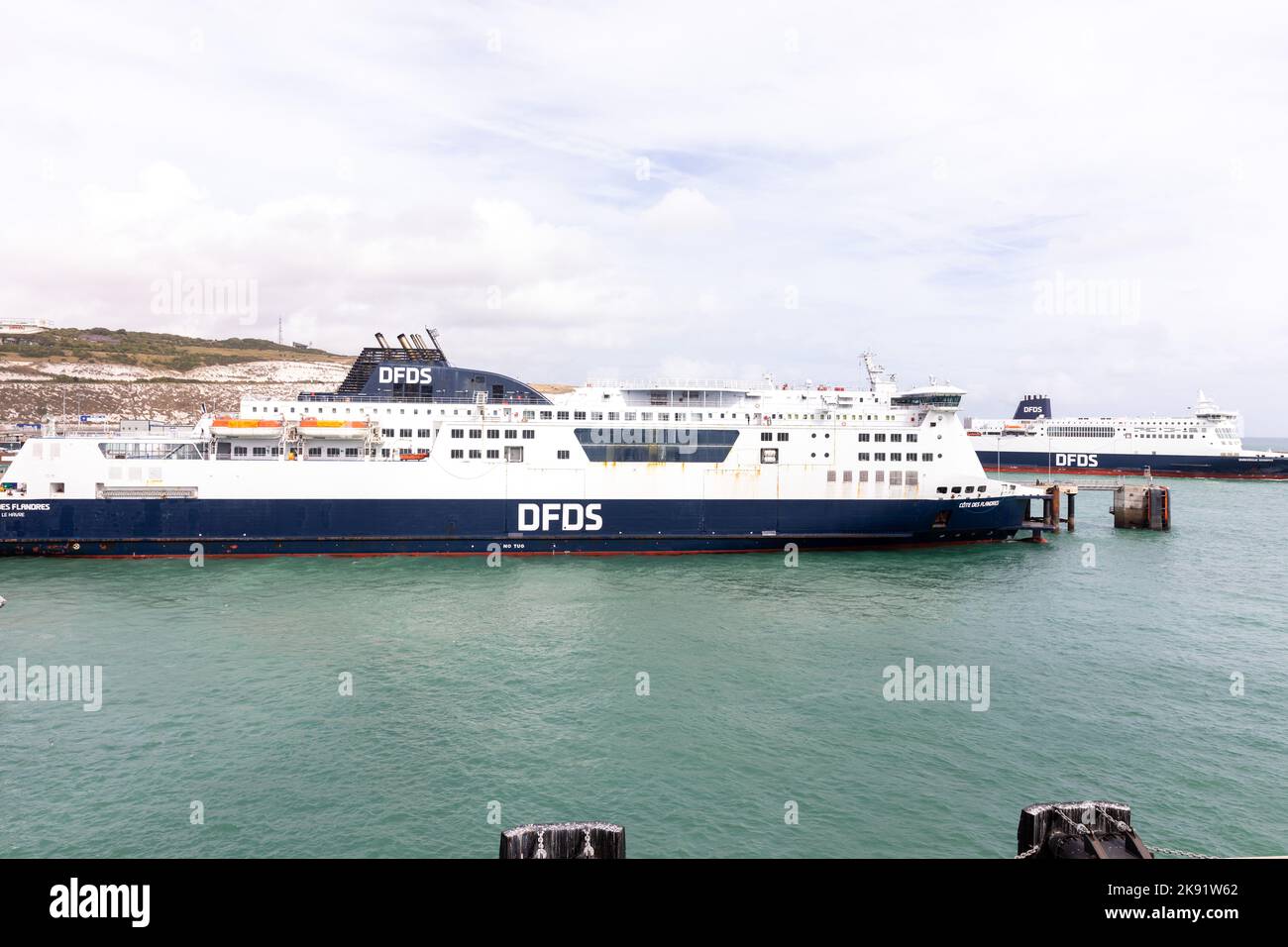 Two DFDS Cross-Channel ferries at Port of Dover, Kent, UK. One setting ...