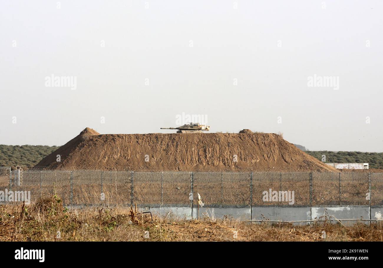 An Israeli tank seen behind a fence during the protest against Israeli ...