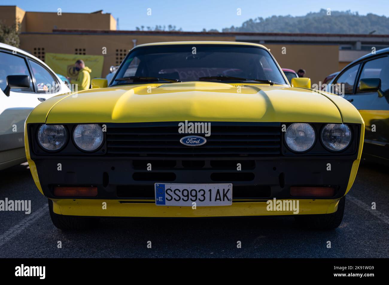 A shiny yellow Ford Capri parked outside Stock Photo - Alamy