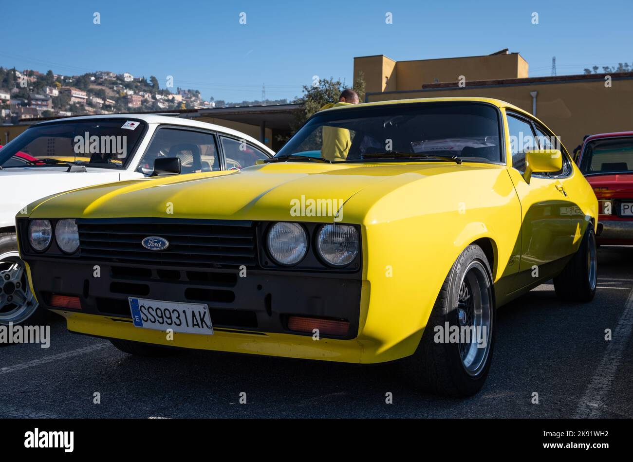 A shiny yellow Ford Capri parked outside Stock Photo - Alamy