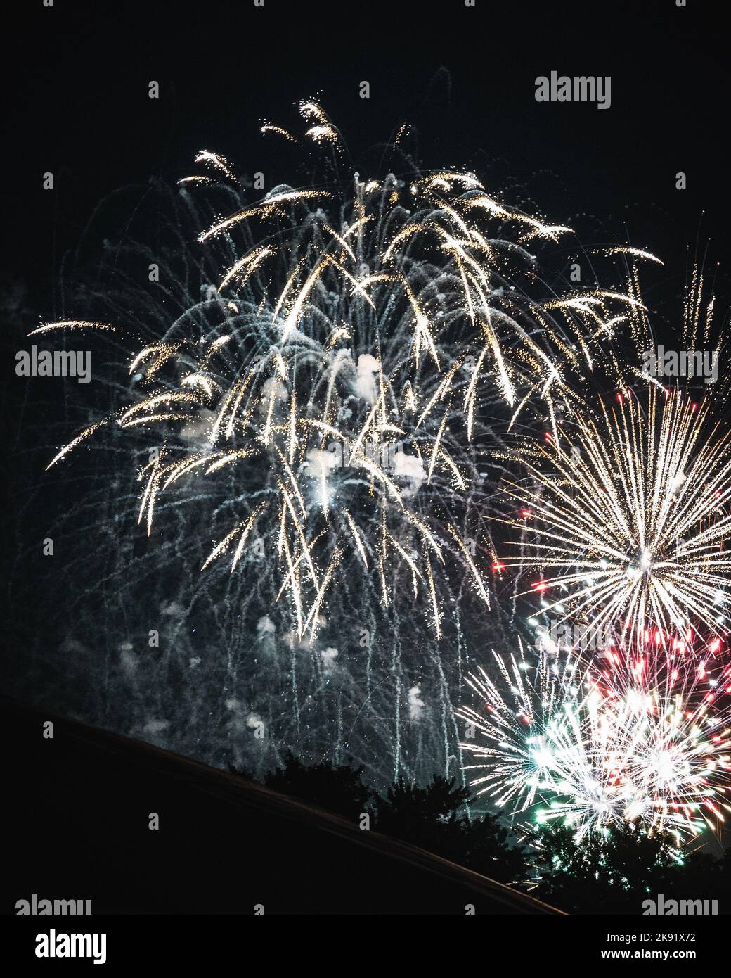 A vertical shot of vivid fireworks on the night sky background Stock ...