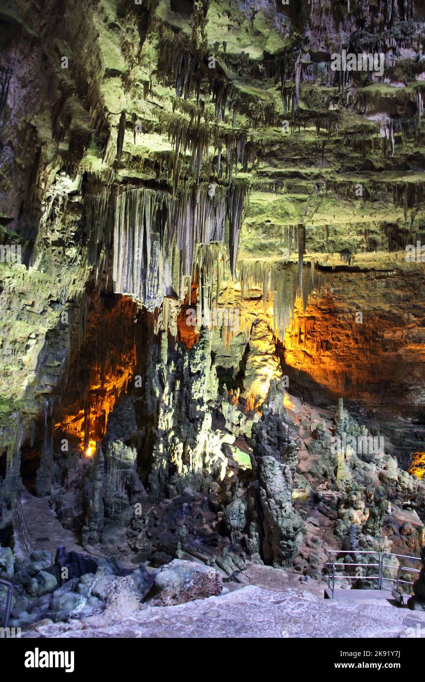 Limestone cave, colorfully illuminated Stock Photo - Alamy