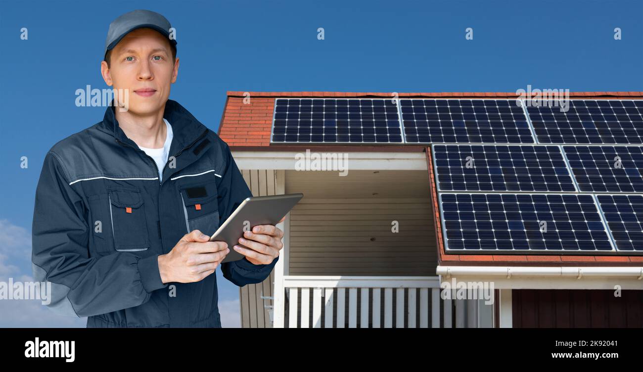 Engineer with tablet computer on a background of solar energy power ...