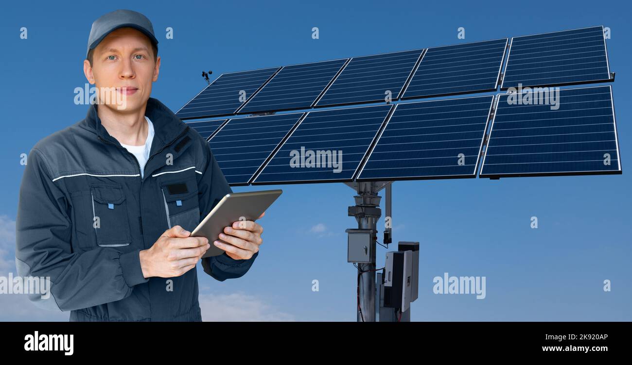 Engineer with tablet computer on a background of solar energy power ...