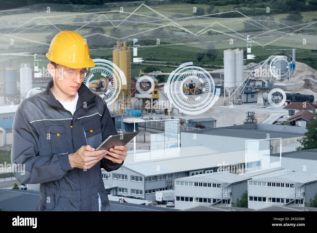 Engineer with digital tablet on a background of modern smart factory ...