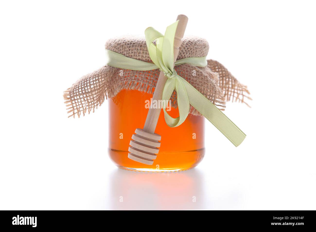 jar of honey with bow photographed on a white background Stock Photo ...