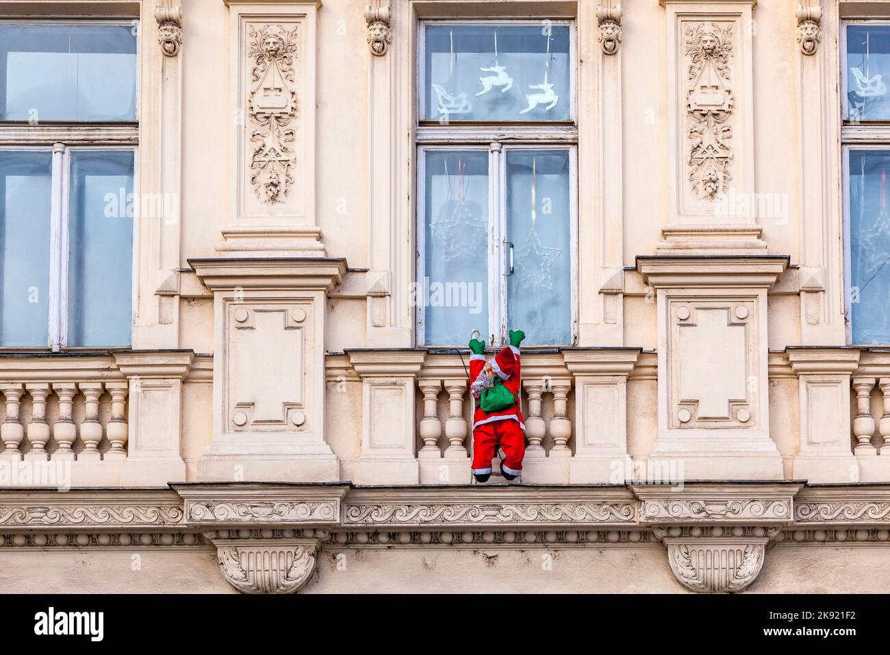 Vienna, Austria - November 27, 2010: Santa claus is climbing up a ...