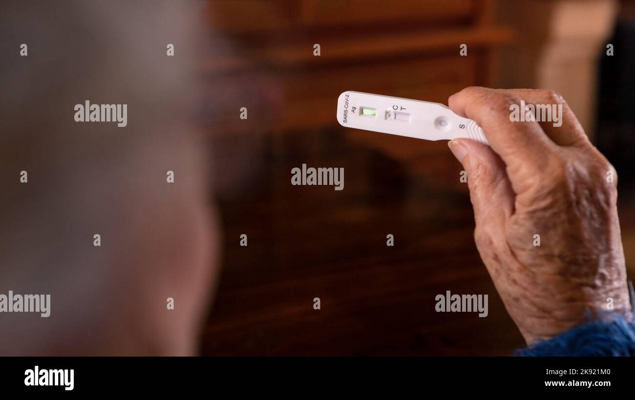 Close-up of caucasian grandma hand holding a buffer dropper for seft ...