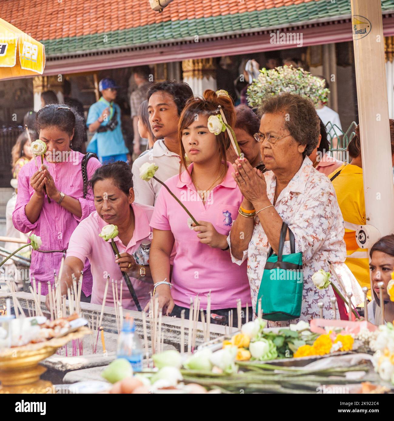 BANGKOK, THAILAND - JAN 4, 2010: people enjoy offerings at the grand ...