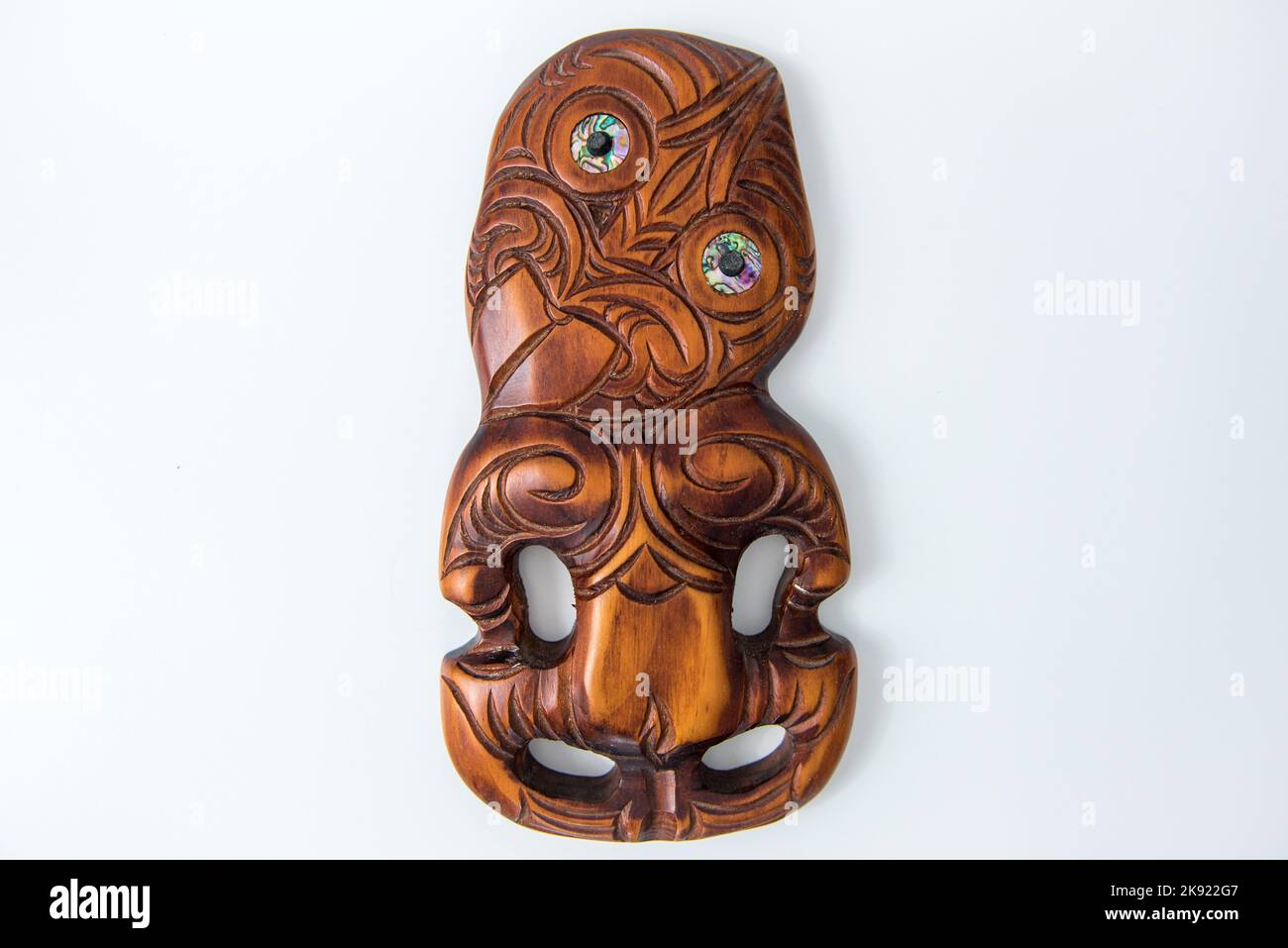 Wooden Maori Hei Tiki hand carved with paua shell eyes. New Zealand ...