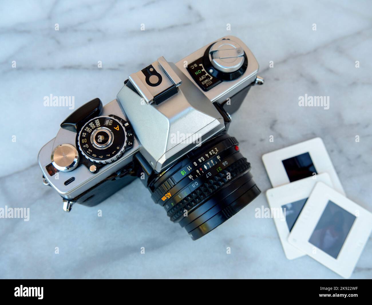 Vintage film camera and slide film Stock Photo - Alamy