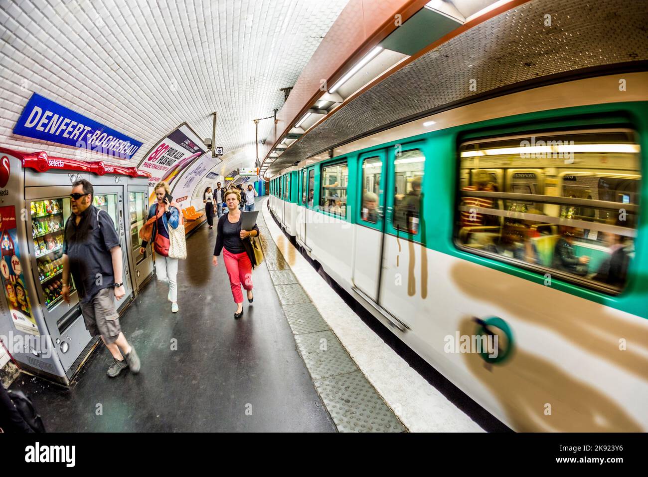 PARIS , FRANCE- JUNE 10, 2015: Tourists and locals on a subway train in ...