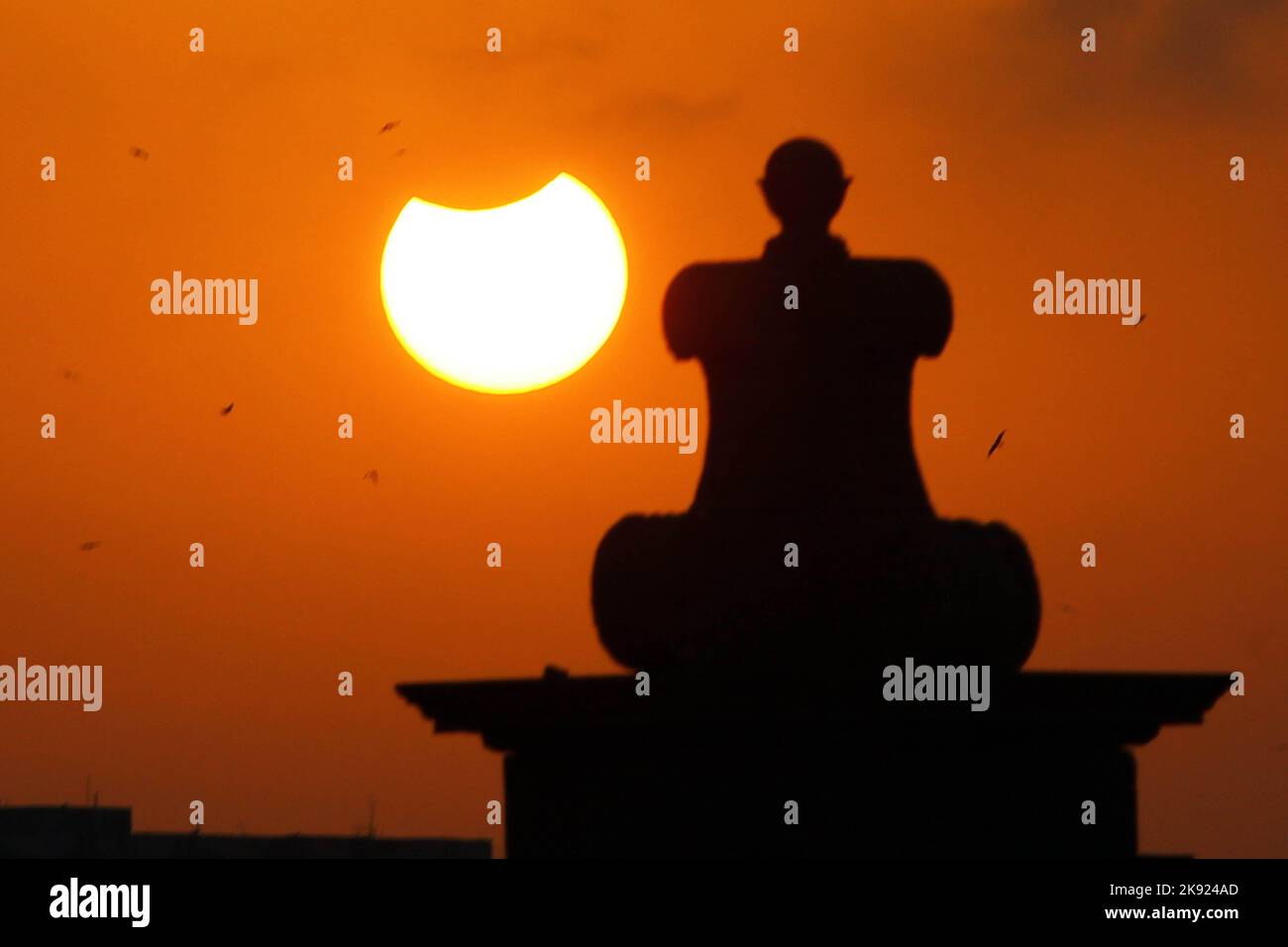 Karachi, Pakistan. 25th Oct, 2022. A partial solar eclipse is pictured ...
