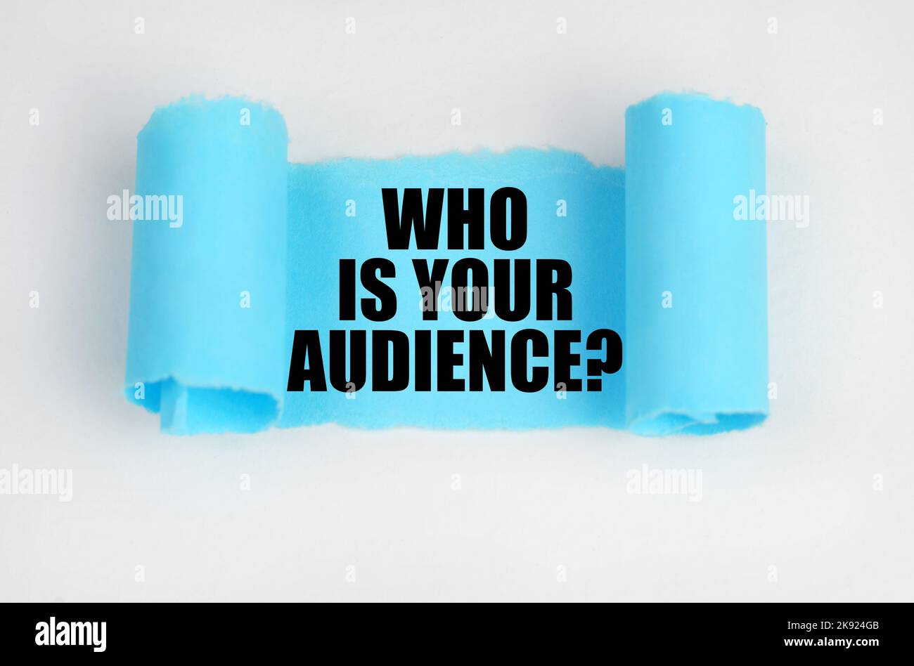 On a white surface, a blue scroll of paper with the inscription - WHO ...