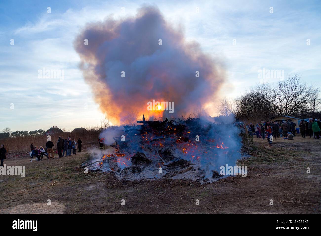 ZEMPIN, USEDOM - MAR 26, 2016: people enjoy the easter fire in Zempin ...