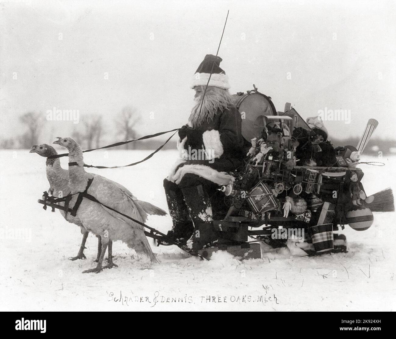 Comical photo of "Santa Claus" with Christmas toys on a sled drawn by ...