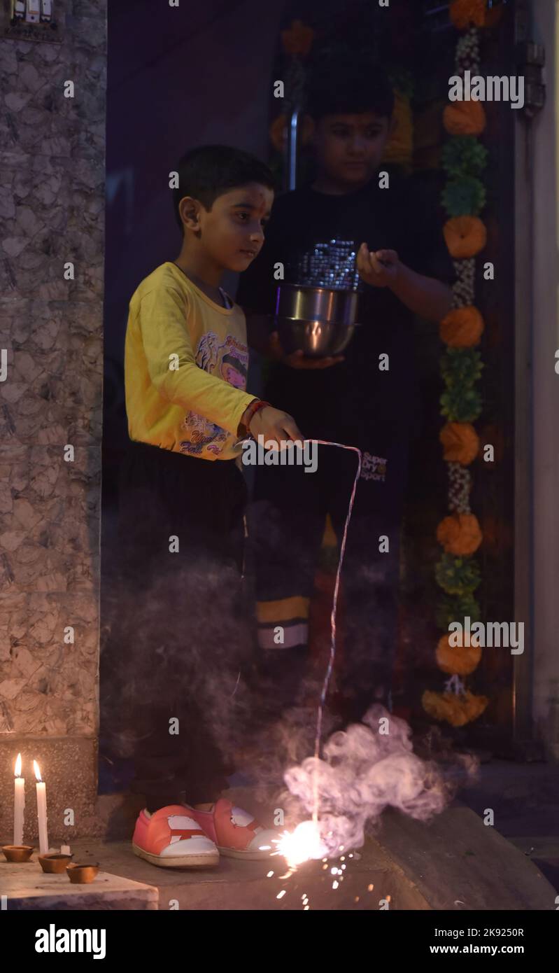 NEW DELHI, INDIA - OCTOBER 24: People burst firecrackers on the ...