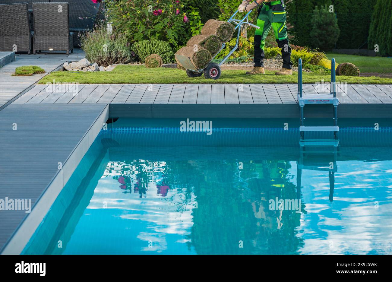Gardener Moving Rolls of Grass Turfs Using Hand Truck Preparing to ...