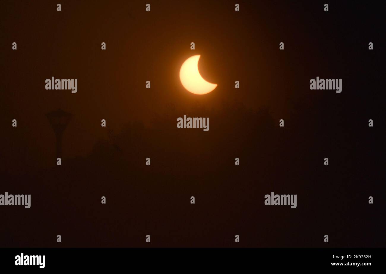 NEW DELHI, INDIA - OCTOBER 25: A view of a partial solar eclipse seen ...
