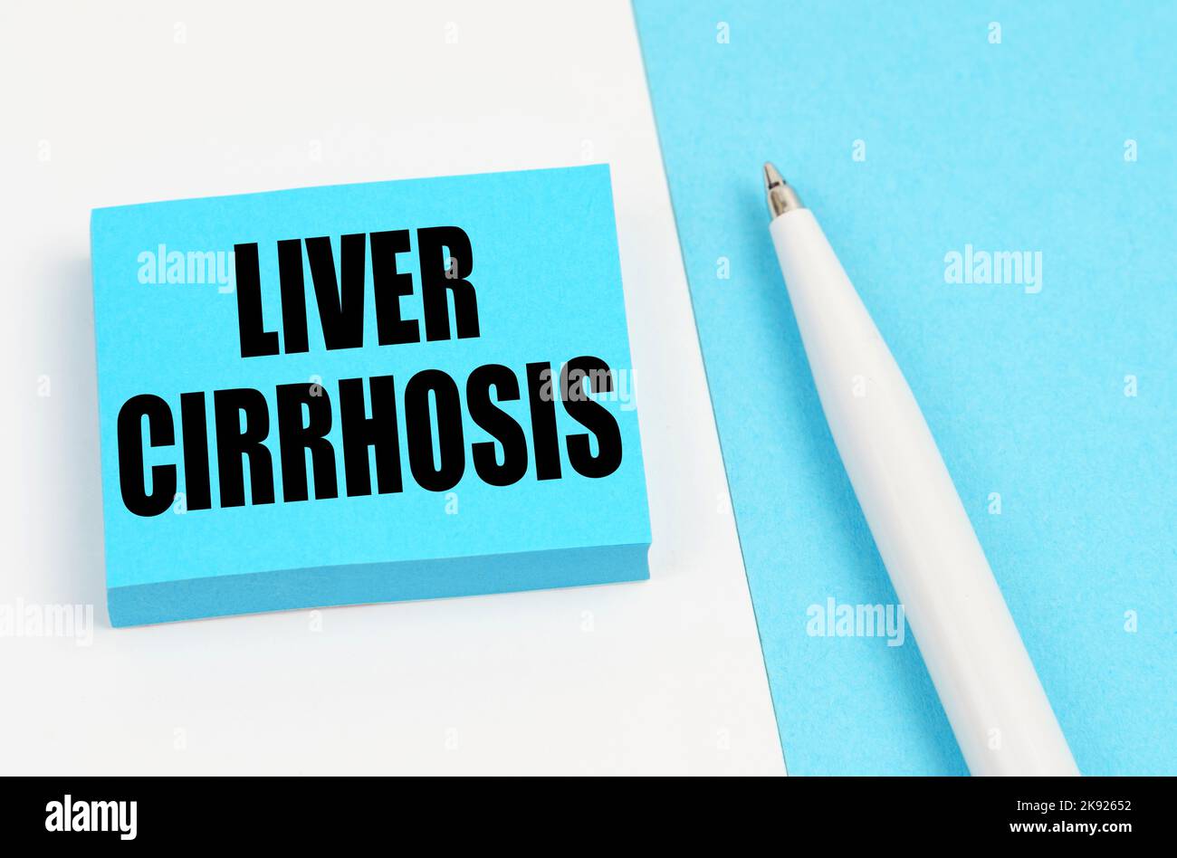 Medical concept. On a white and blue surface, a pen and blue stickers ...