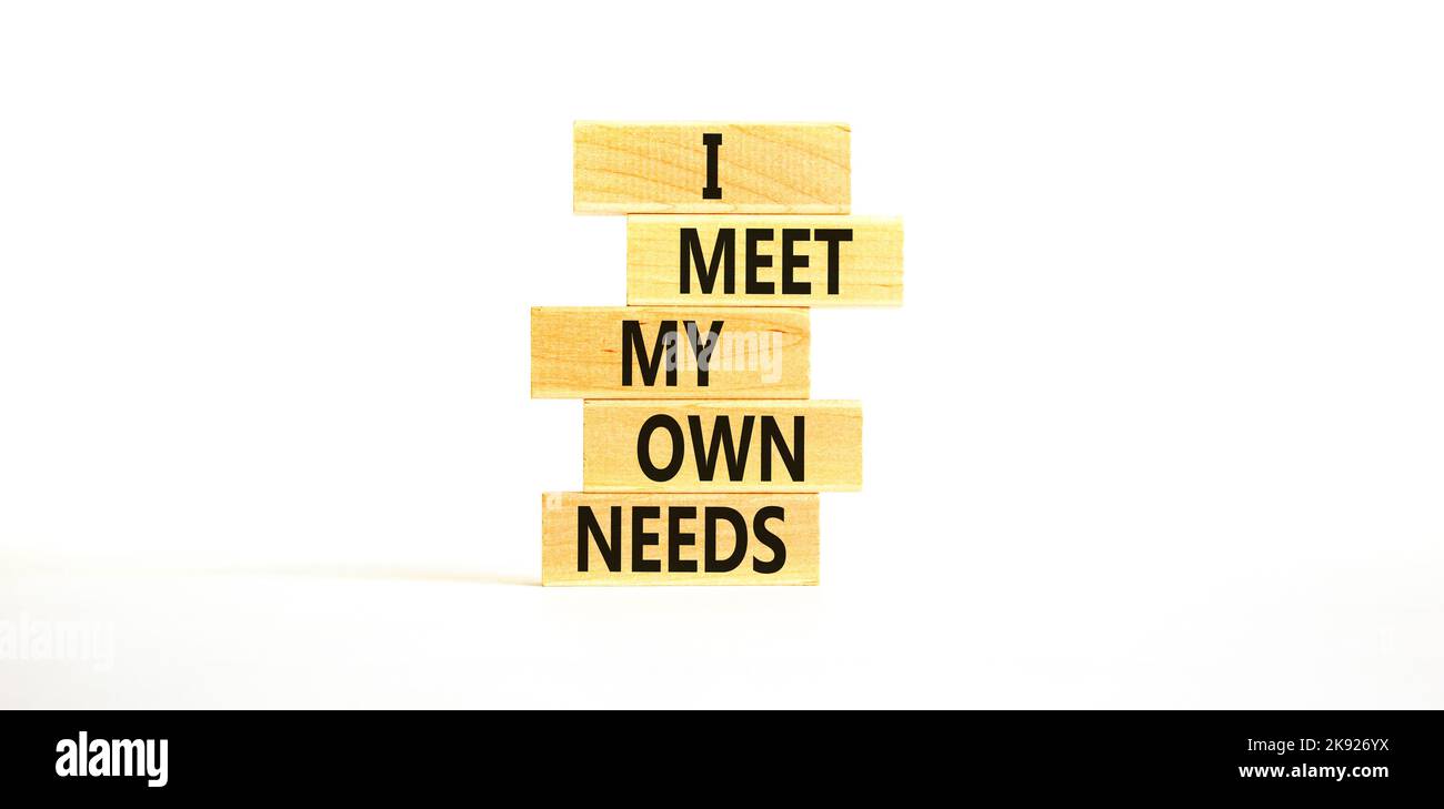 I meet my own needs symbol. Concept words I meet my own needs on wooden blocks. Beautiful white ...