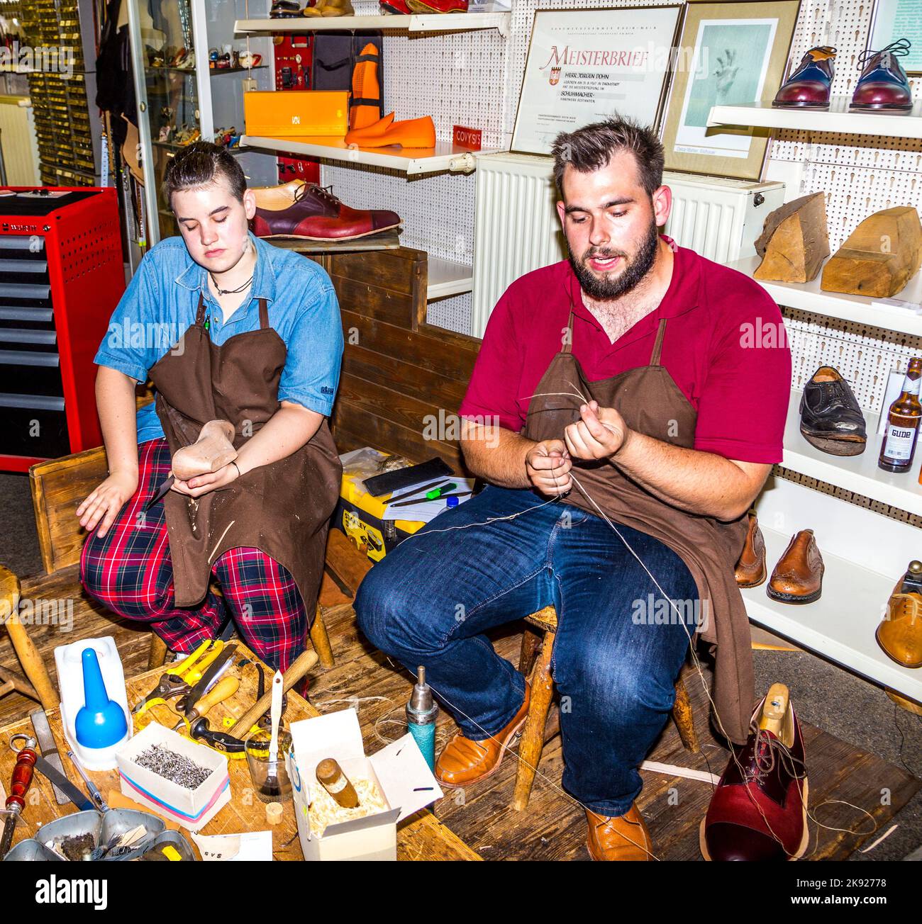 FRANKFURT, GERMANY - SEP 8, 2016: the shoemaker opens his shop at the ...