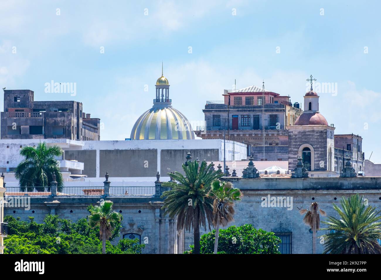 The Capitolio golden dome contrasts with colonial and weathered ...