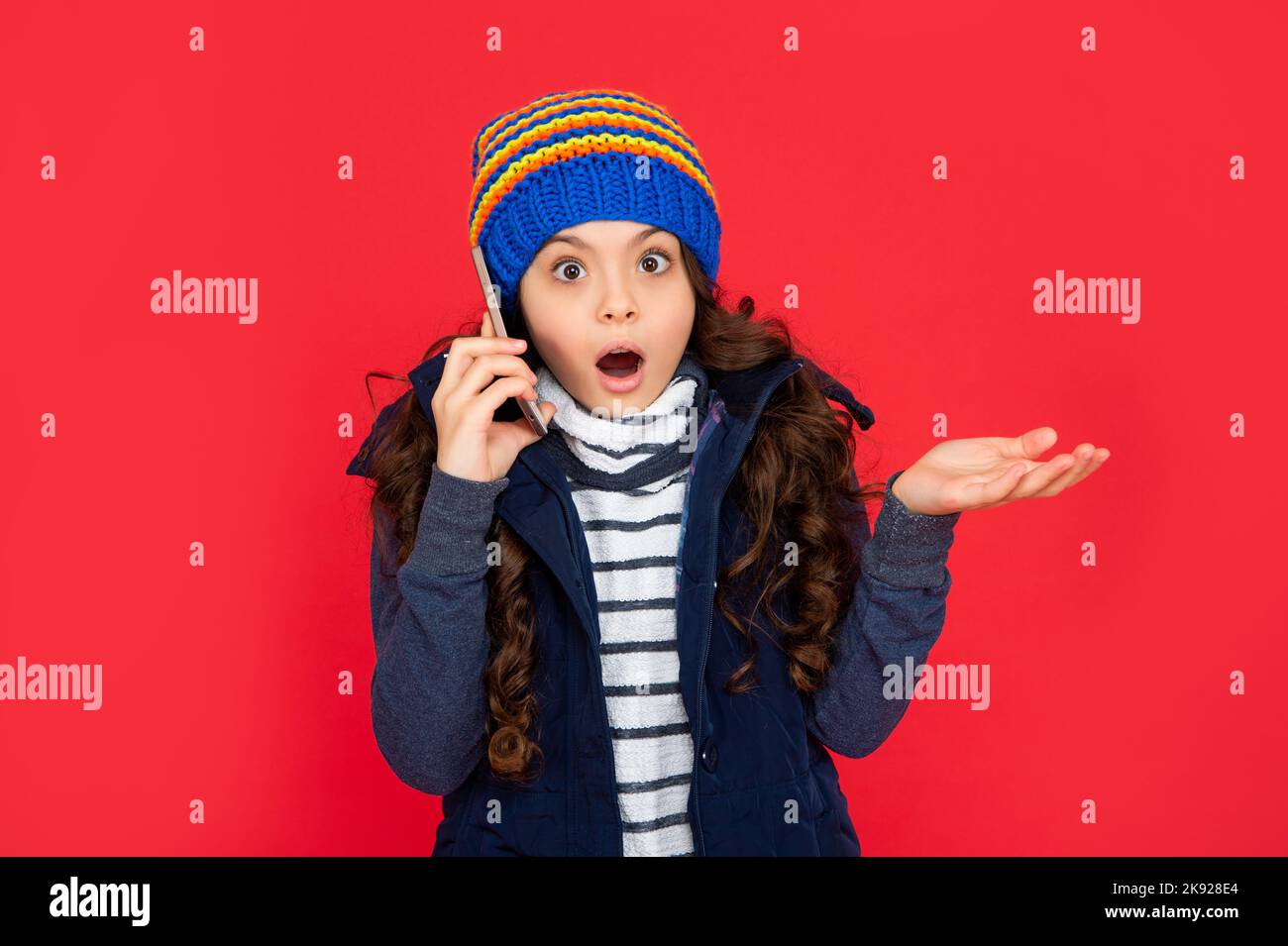 portrait of child greeting while phone conversation. communication ...