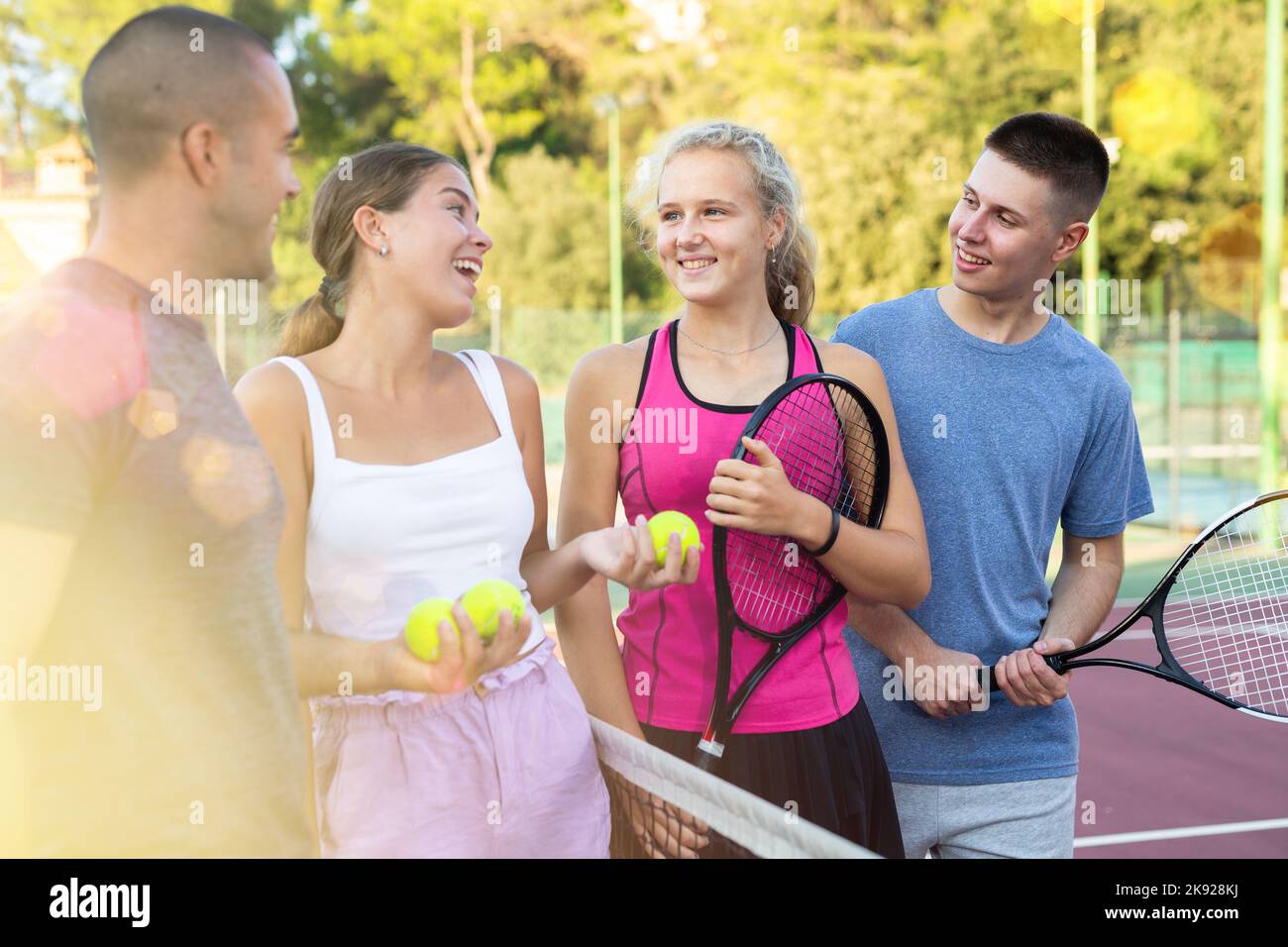 Group photo of positive people talking Stock Photo - Alamy