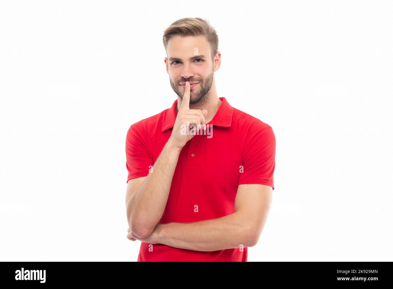 young guy with hush gesture isolated on white background. unshaven guy ...